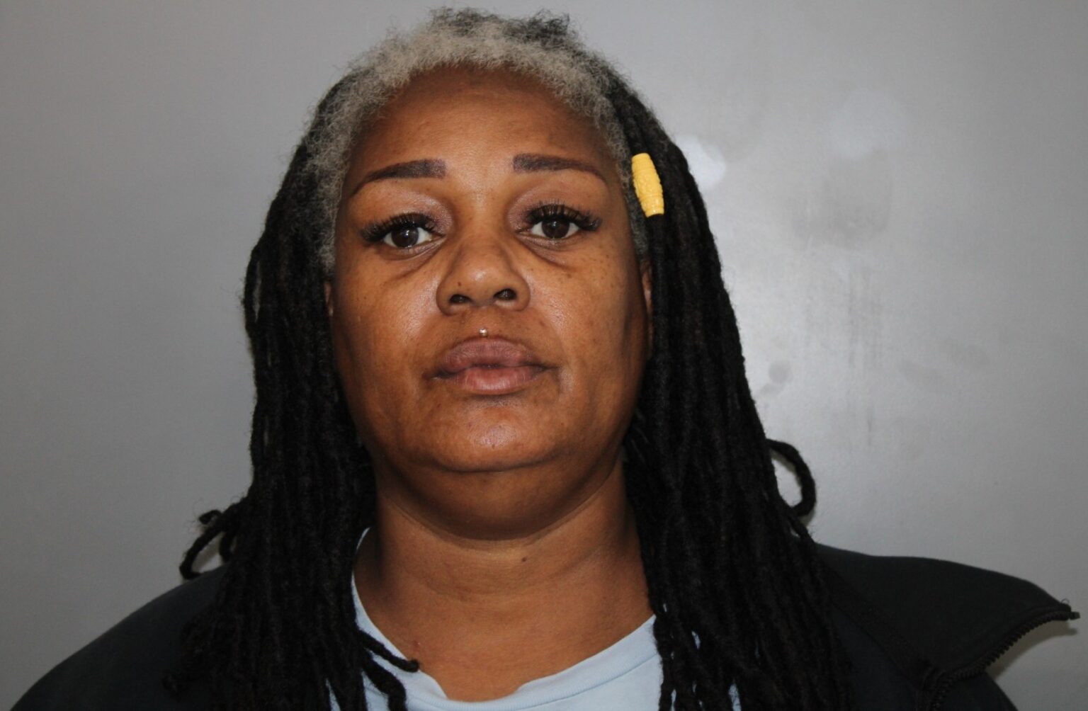 Woman jailed after allegedly forcing boy’s hand onto hot stove, causing ...